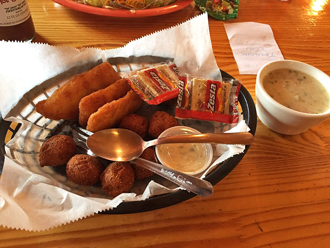 Comfort food that doesn't need a fancy introduction – just crispy, golden goodness served with dipping sauce and absolutely zero pretension.