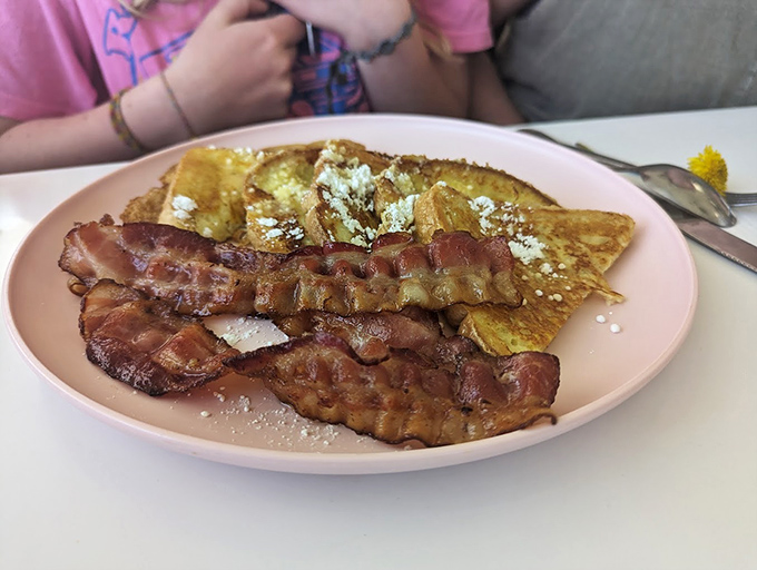 French toast and bacon: The dynamic duo of breakfast. It's like Batman and Robin, if Batman were made of bread and Robin were deliciously crispy.