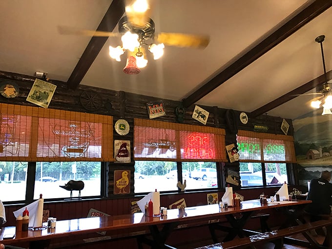 Rustic charm overload! With its cozy booths and quirky decor, this dining area feels like your cool uncle's cabin – if he were a BBQ master.