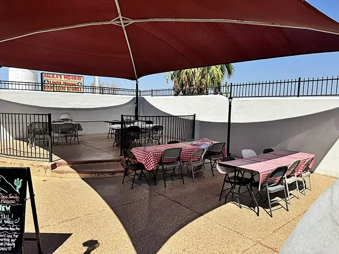 Arizona sunshine and barbecue—nature's perfect pairing. These red-checkered tables under the desert sky are prime real estate for meat enthusiasts.