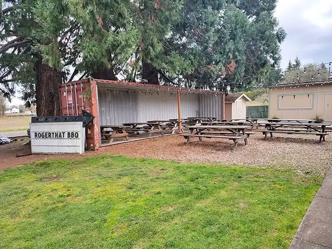 The outdoor picnic area—where Oregon's fresh air somehow makes the barbecue taste even better, like nature intended us to eat smoked meat under trees.