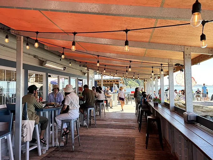 Happy hour, seaside style! Nothing beats good food, good company, and a view that makes you want to write poetry – or at least a really good Yelp review.