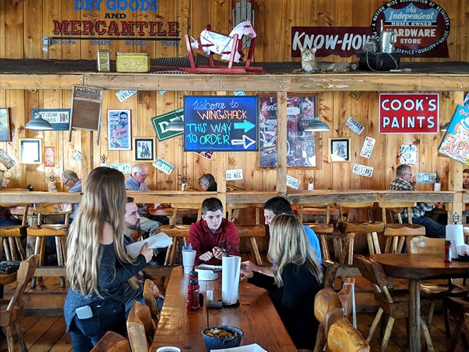 Families gather around wooden tables, proving that good food still has the power to pull teenagers away from their phones—if only temporarily.