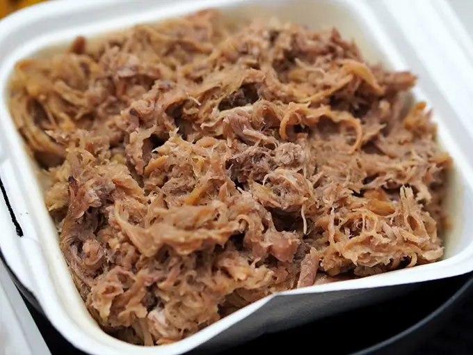Pulled pork so tender and juicy, it's like the meat equivalent of a ukulele serenade. Each forkful is a little hula dance for your mouth.