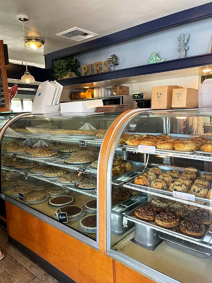 Pie overload alert! This display case is a sweet tooth's kryptonite – resistance is futile.