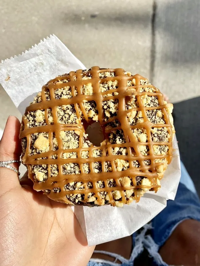 Caramel, chocolate, and brioche, oh my! This donut is living its best life, and it wants you to join the party.