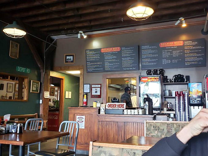 Order up! The counter at Railroad Bill's is where the magic happens, with friendly staff ready to serve up your next culinary adventure.