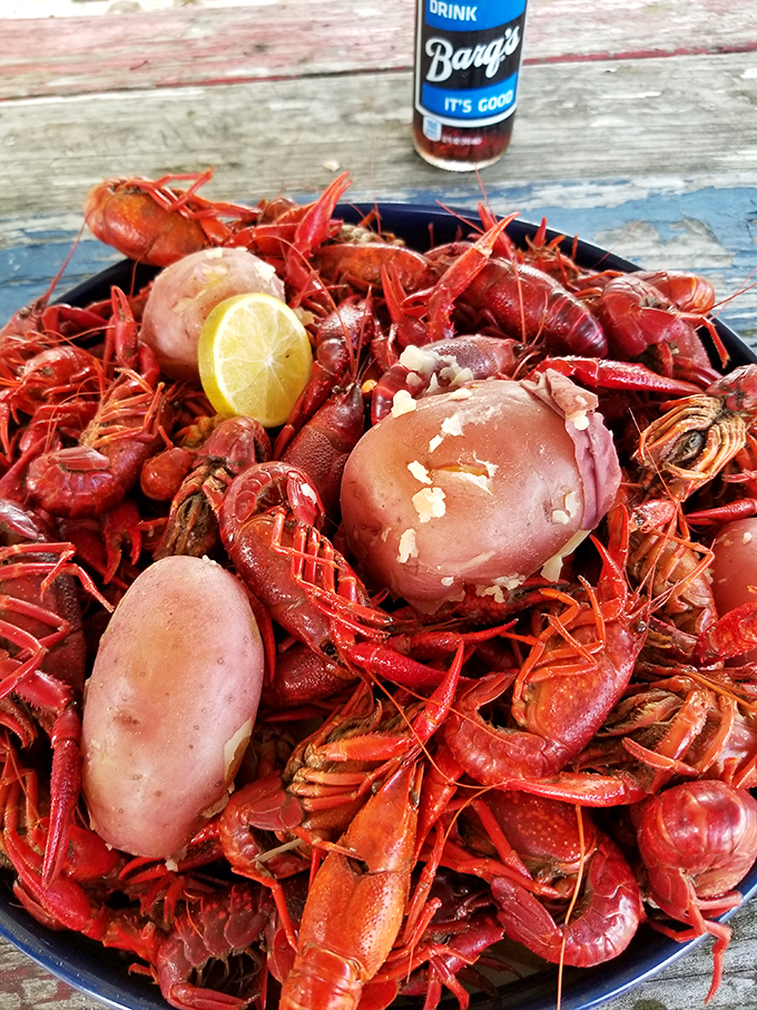 Holy crawfish, Batman! This mountain of mudbugs looks like it could feed a small army – or one very determined Louisianan.