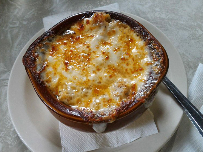 French onion soup that's achieved the perfect cheese-pull-to-broth ratio – a bubbling cauldron of comfort that's worth every potential roof-of-mouth burn.