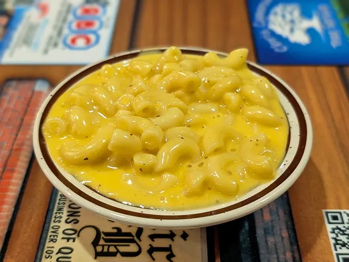 Mac and cheese that doesn't know it's a side dish—it's staging a delicious coup to become the main event with its molten, creamy rebellion.