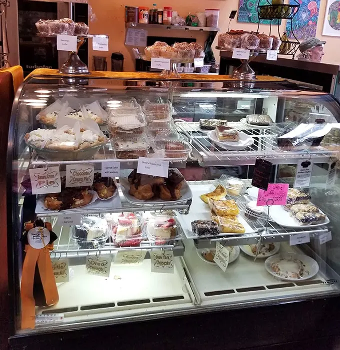 Pastry perfection on parade! This display case is the Louvre of baked goods – each one a masterpiece of butter and sugar.
