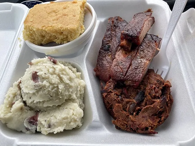 The holy trinity of BBQ! Ribs, pulled brisket, and sides – it's like the Avengers assembled on your plate, ready to save your appetite.