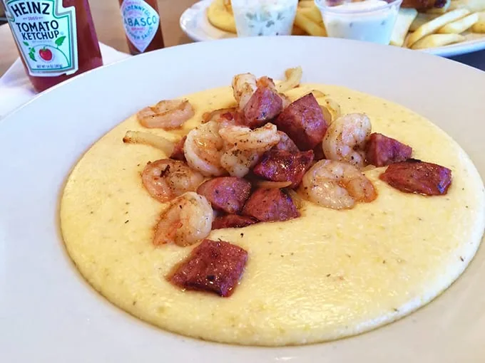 Shrimp and grits elevated to an art form—creamy cornmeal canvas topped with perfectly seasoned shrimp and sausage. Southern comfort reimagined.