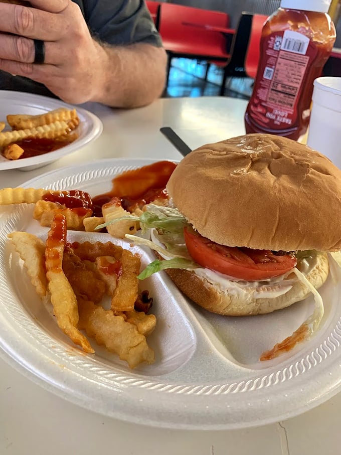 A burger that requires both hands and several napkins. The crinkle-cut fries aren't just sides—they're essential supporting characters in this lunch drama.
