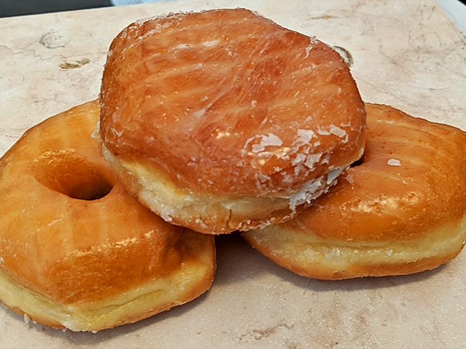 Golden rings of glory! These glazed donuts shine brighter than my grandmother's prized china collection.
