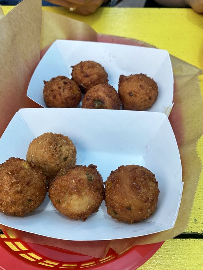 Hush, little puppies! These golden nuggets of cornmeal joy are crispy on the outside, fluffy on the inside, and addictive all over.