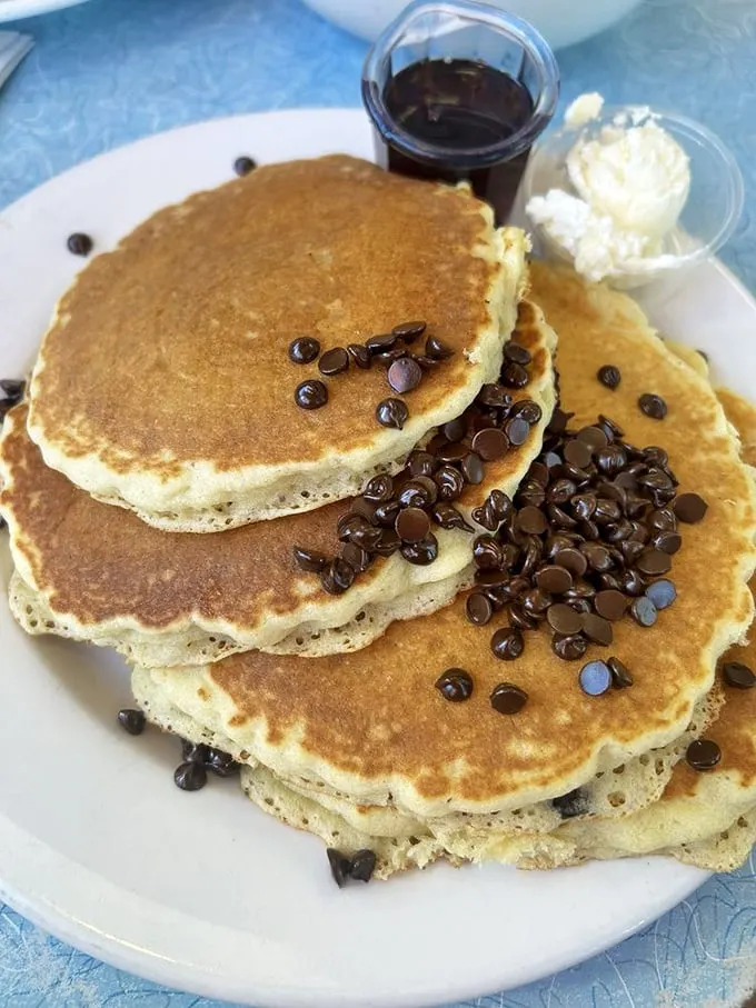 These chocolate chip pancakes don't whisper sweetness—they declare it proudly with a golden-brown swagger that says "Yes, this is breakfast candy."