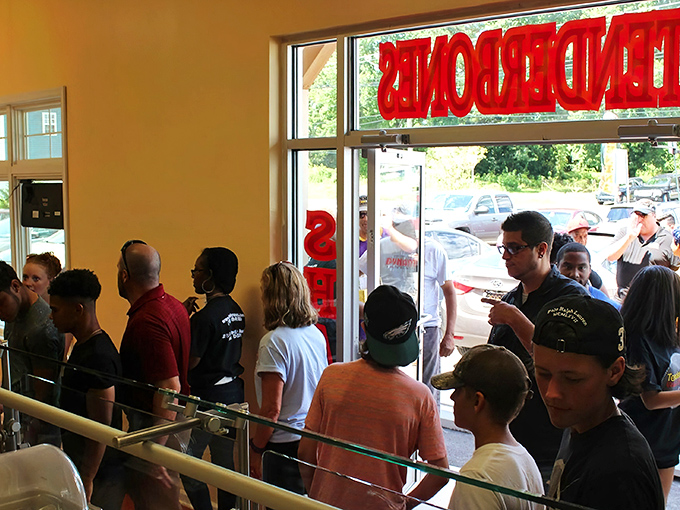 The line says it all – these folks know the secret to happiness is smoky, saucy, and served with a side of patience.
