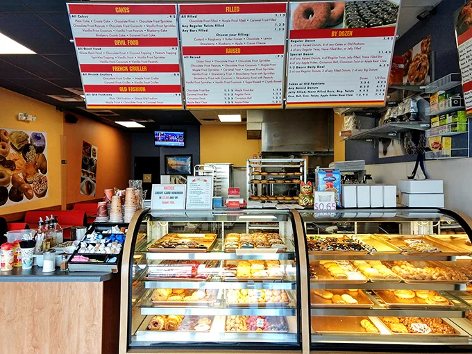 Donut nirvana achieved! This display case is like an art gallery, but with edible masterpieces that would make Van Gogh drool.