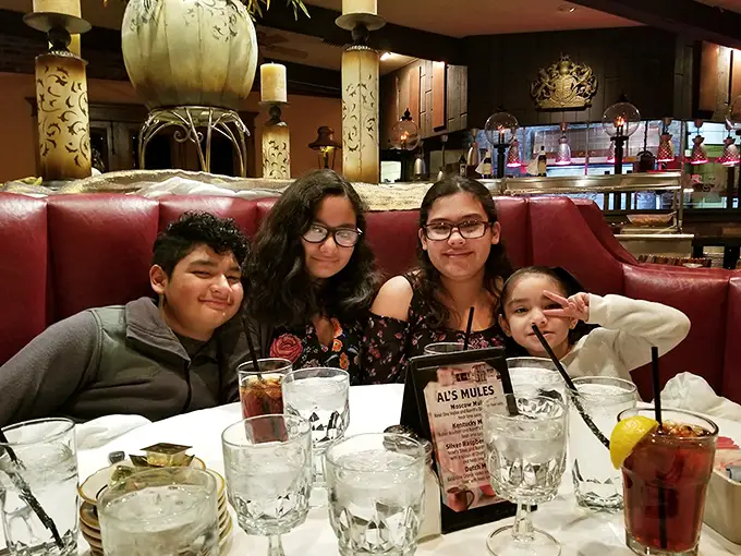 In the booth where memories are made, families gather around glasses filled with promise and menus filled with possibilities.