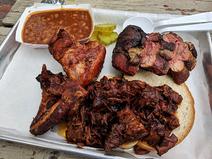 The holy trinity of BBQ! This 3-meat combo is like a flavor explosion in your mouth – no taste bud left behind.