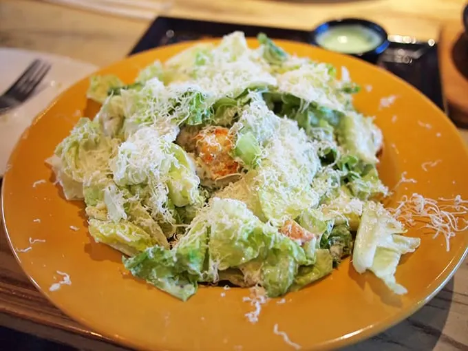 Caesar salad fit for an emperor! With enough cheese to make Wisconsin jealous, this leafy delight is no mere side dish.