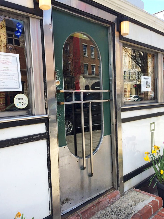 The diner's distinctive oval door isn't just an entrance – it's a portal to a simpler time when breakfast was serious business and calories weren't counted.