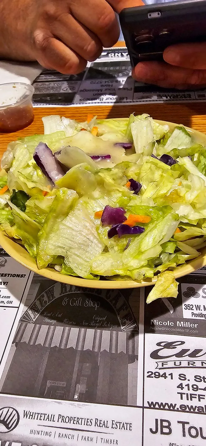 A nod to nutrition or a palate cleanser? This vibrant salad is like the opening act at a rock concert – appreciated, but we're here for the headliner.