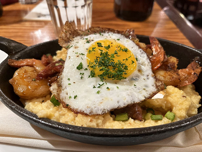 Shrimp and grits with a sunny-side up surprise. It's comfort food that got a first-class upgrade and a beachfront view.