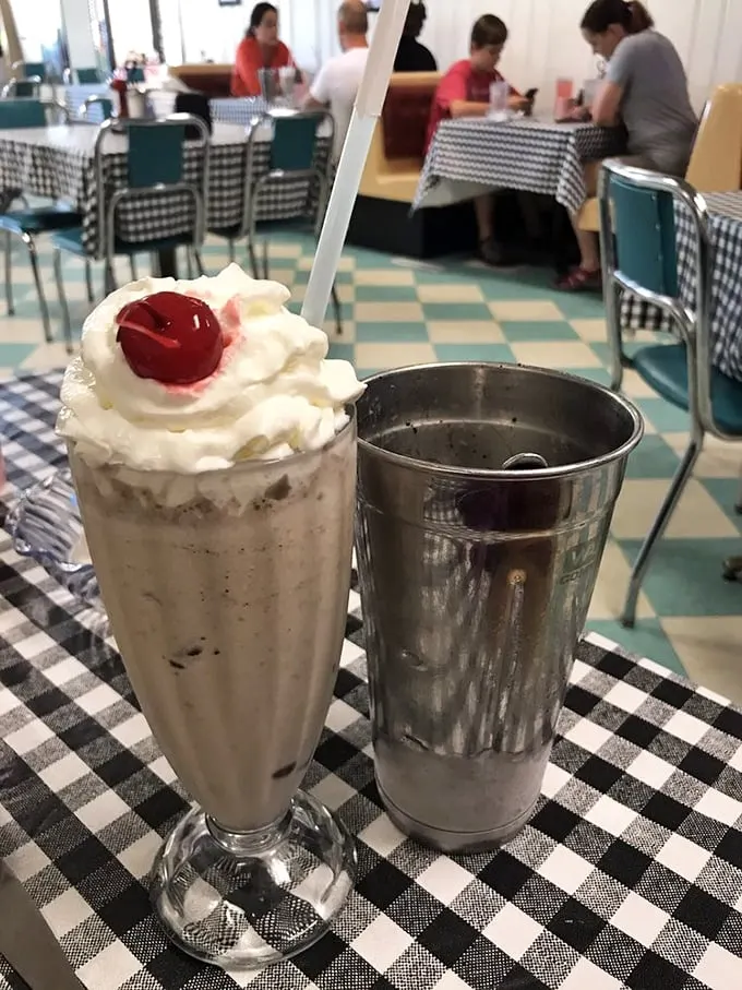 Shake, rattle, and roll! This milkshake is so thick, it's practically a workout for your straw. Topped with whipped cream and a cherry, it's pure soda fountain magic.