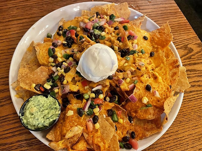 Nachos that could unite nations! A mountain of cheesy, crunchy goodness that's worth scaling, fork in hand.