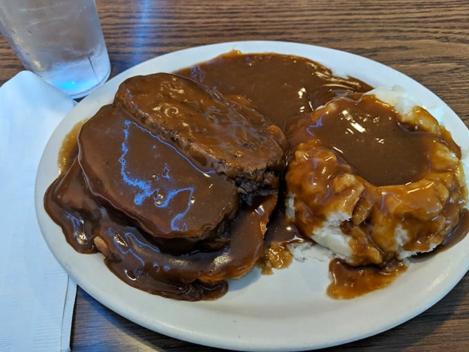 Pot roast so tender, it falls apart faster than New Year's resolutions. Smothered in gravy, it's comfort food that could make even a tough guy misty-eyed.