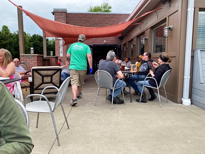 The outdoor patio offers fresh air dining under a rustic canopy—because sometimes wings taste even better with a side of sunshine.