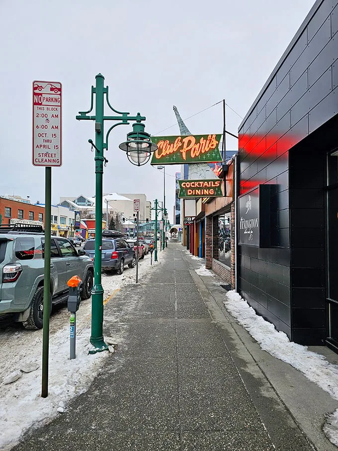 Winter wonderland meets culinary paradise. Club Paris stands as a beacon of warmth and flavor amidst the Alaskan chill – just follow the neon glow!