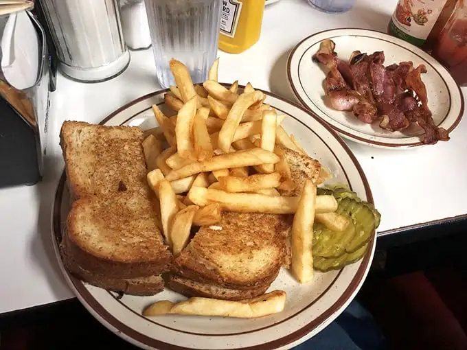 The sandwich that comfort food dreams are made of! Melty cheese, crispy chicken, and golden fries – a trio so perfect, it should have its own Grammy category.