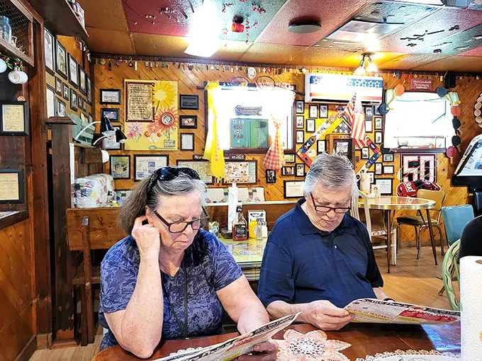 Diners deep in thought – probably deciding between the "Famously Foxfire" options. The struggle is real when everything looks finger-lickin' good!