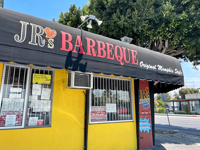 Sunny side up! J&R's cheerful exterior is like a barbecue oasis in the urban landscape, promising smoky delights within its yellow walls.