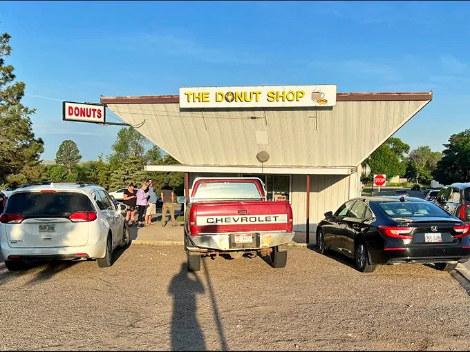 The line that's worth the wait. These eager customers know that good things come to those who queue for The Donut Shop's delights.