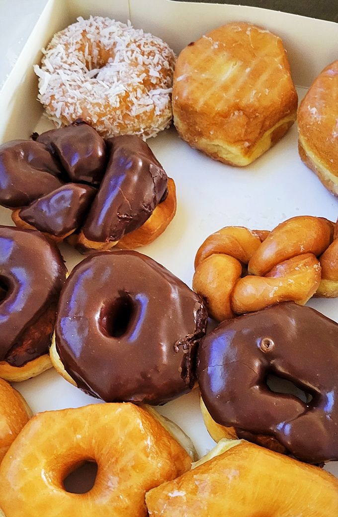 A box of pure joy! This assortment is like the Avengers of the donut world – each one a superhero of sweetness.