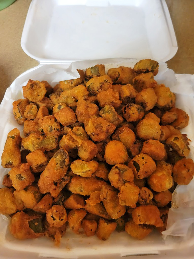 Fried okra: the South's crunchy little secret. These golden nuggets are like vegetable candy – addictively delicious!