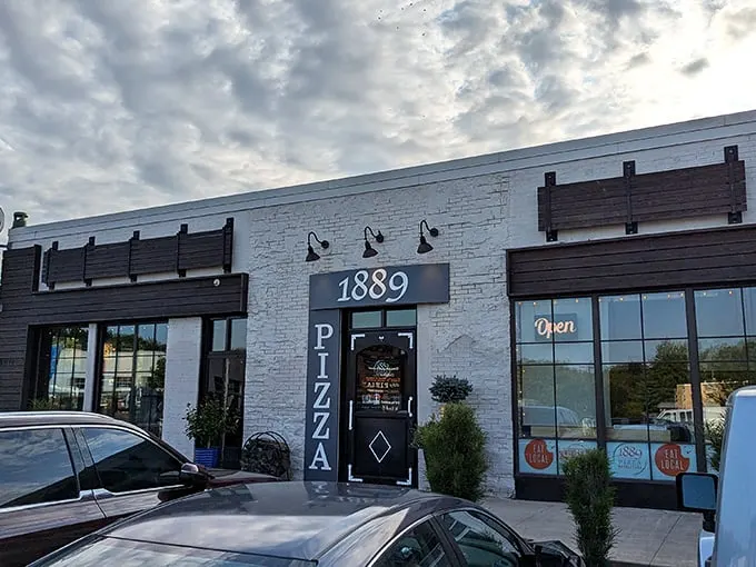 Twilight at 1889 Pizza—where that "OPEN" sign might as well say "Your diet ends here."