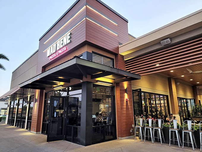 Mama mia! Mad Bene's modern facade hides a pizza paradise inside. It's like finding a Gucci store in a tiki hut – unexpected, but oh so delightful!