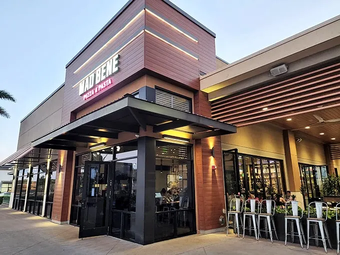 Mama mia! Mad Bene's modern facade hides a pizza paradise inside. It's like finding a Gucci store in a tiki hut – unexpected, but oh so delightful!