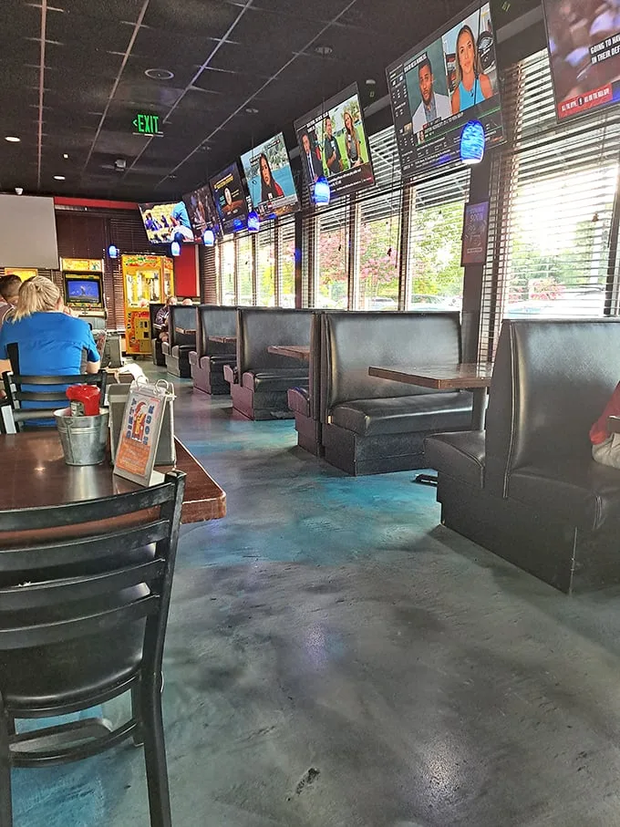 Inside, the perfect sports bar atmosphere awaits: dark booths, multiple TVs, and the promise that whatever game you're following, you won't miss a single play.