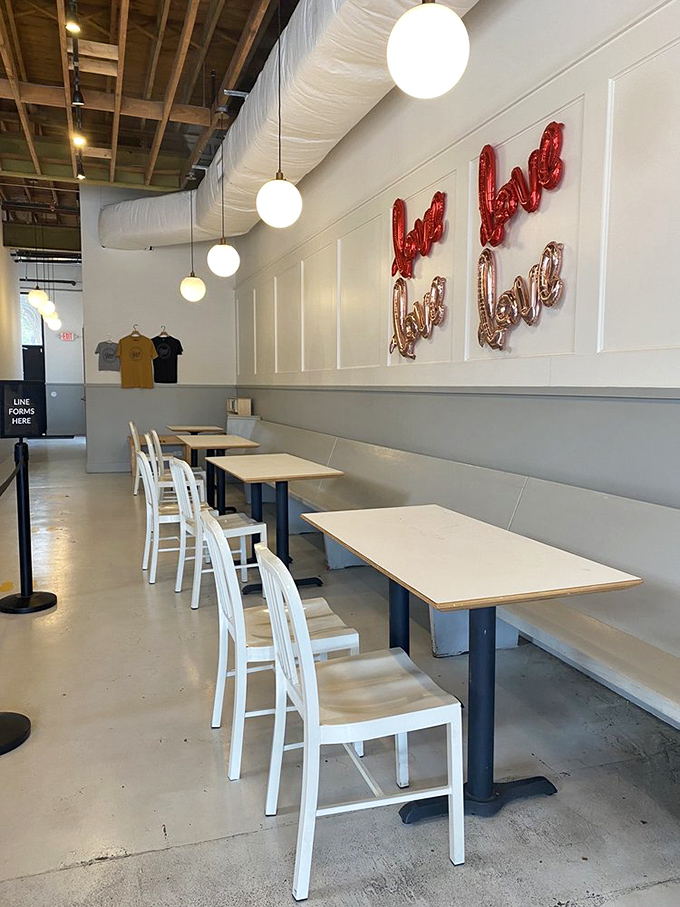 Modern minimalism meets baking brilliance. The "Love" balloon letters aren't just decor—they're the unofficial motto of anyone who's tasted these donuts.