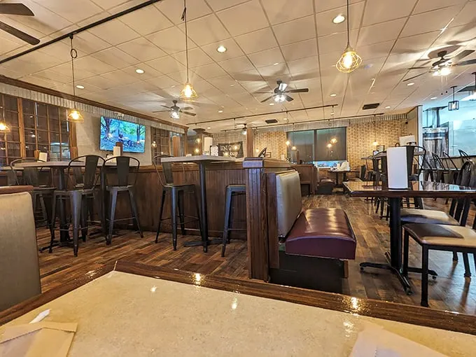 Inside, warm wood tones and industrial touches create that perfect "I could stay here all afternoon" vibe that every great BBQ joint needs.