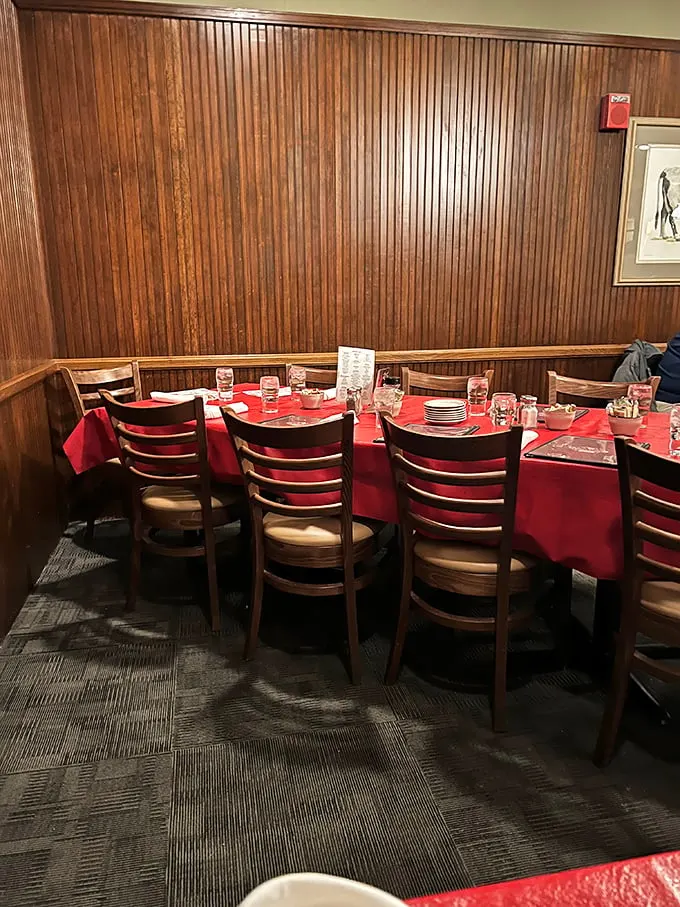 Classic wood paneling and red tablecloths create that perfect "special occasion without pretension" vibe that's increasingly rare in today's dining landscape.