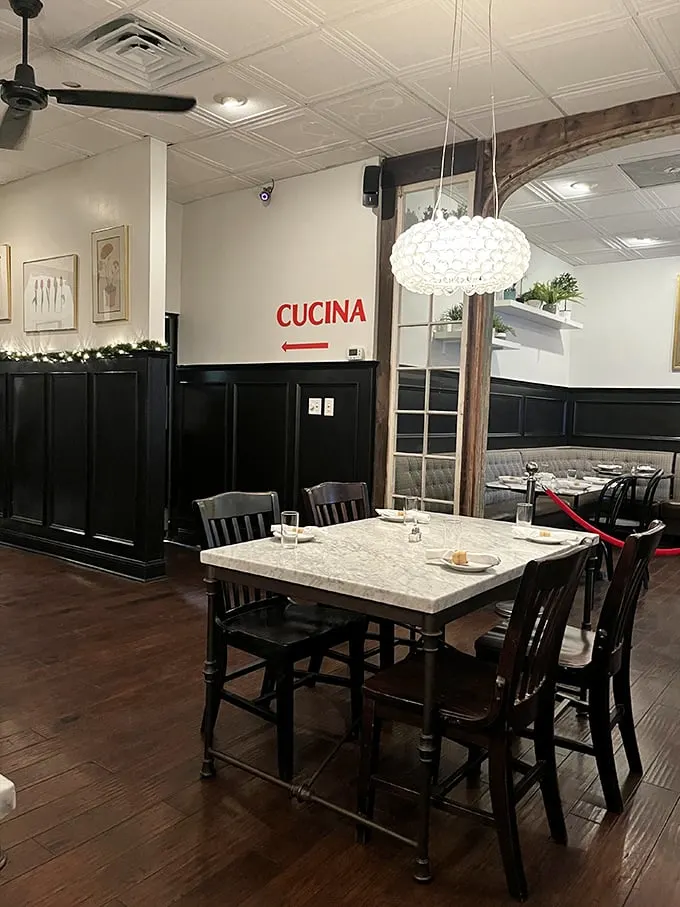 Step into a world where "Cucina" isn't just a sign – it's an invitation to indulge in comfort and class, all under a twinkling chandelier.