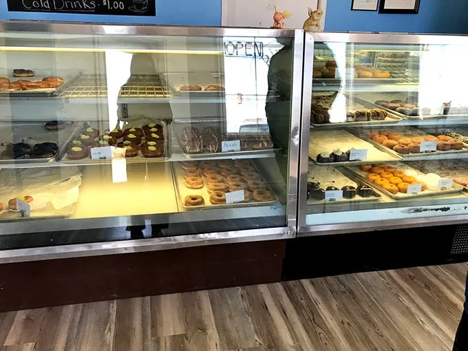 Decisions, decisions! This glass case is a treasure trove of temptation, each tray a canvas of culinary creativity.