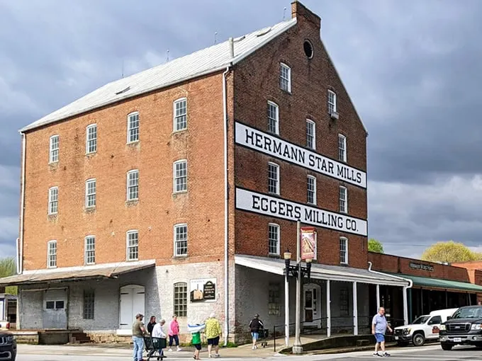 This imposing brick mill stands as Hermann's industrial cathedral – where grain once became glory and history remains etched in every weathered brick.